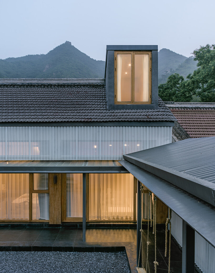 a contemporary inn is hidden within an ancient city near china's great wall
