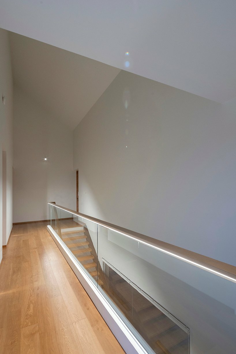 austere geometric volumes compose white 'rupu house' in bangkok