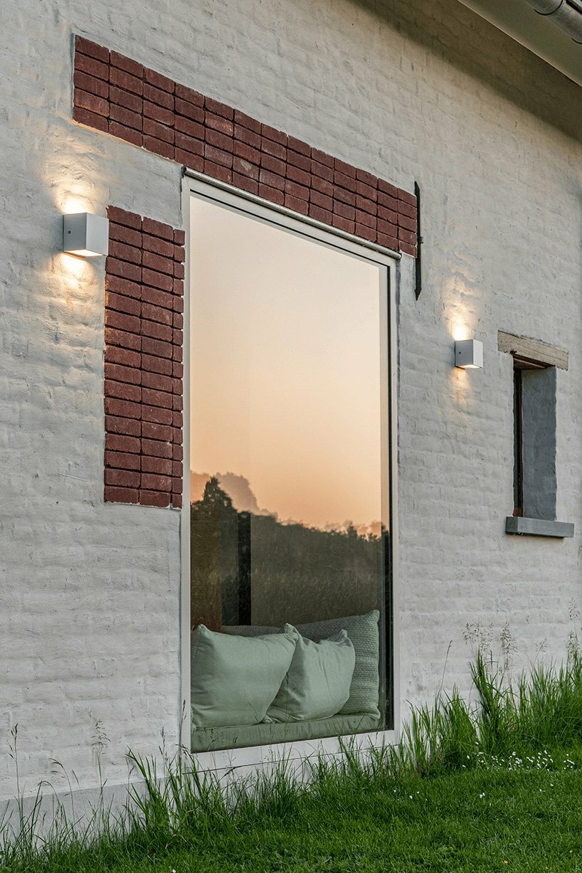 objekt architecten exposes red brickwork on farmhouse's facade