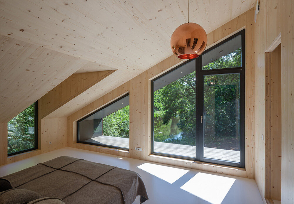 protruding windows bring nature inside spee architecten's sustainable ...