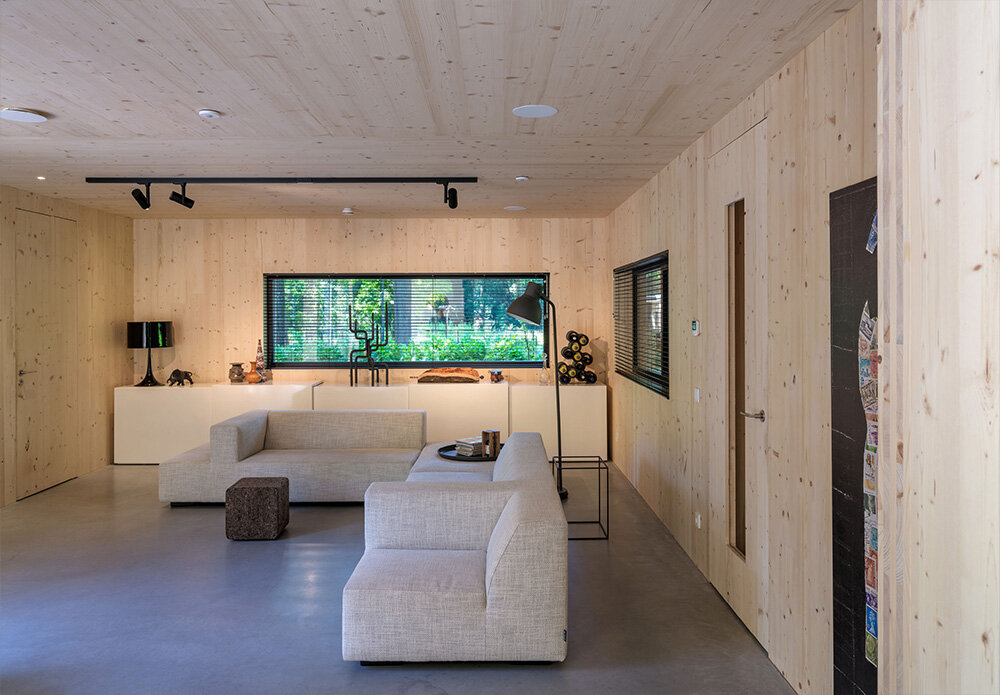 protruding windows bring nature inside spee architecten's sustainable ...