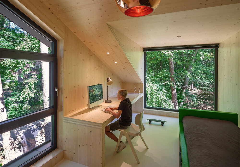 protruding windows bring nature inside spee architecten's sustainable ...