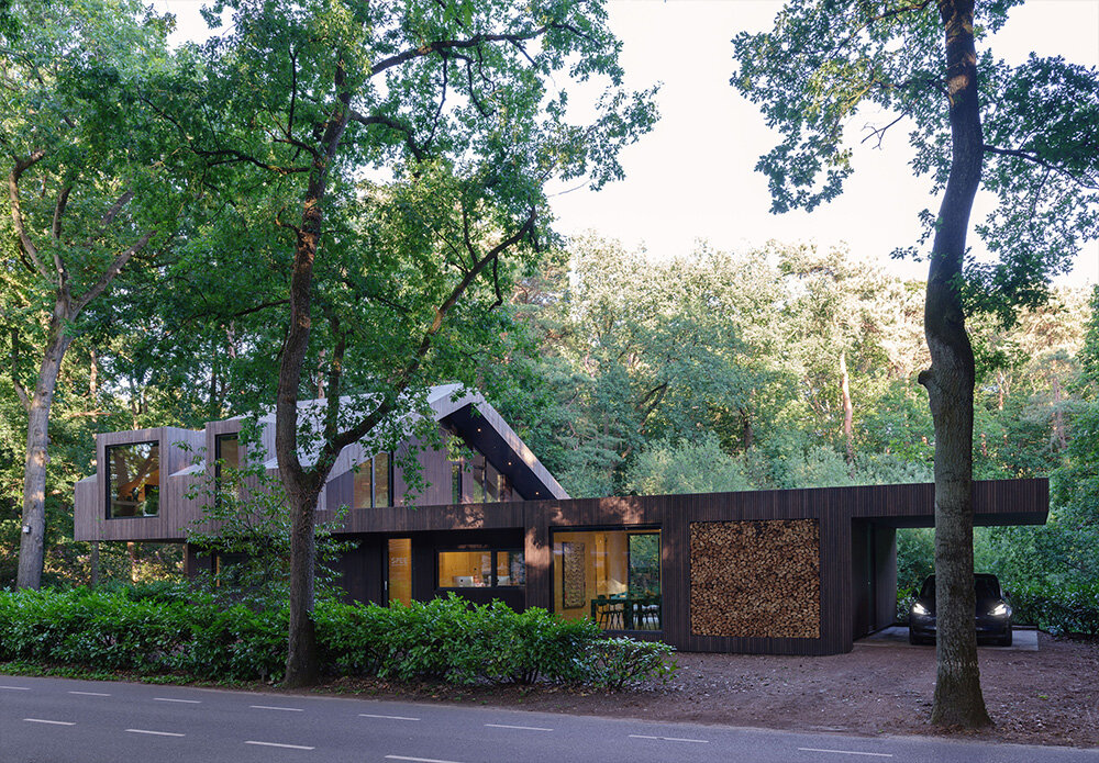 protruding windows bring nature inside spee architecten's sustainable ...