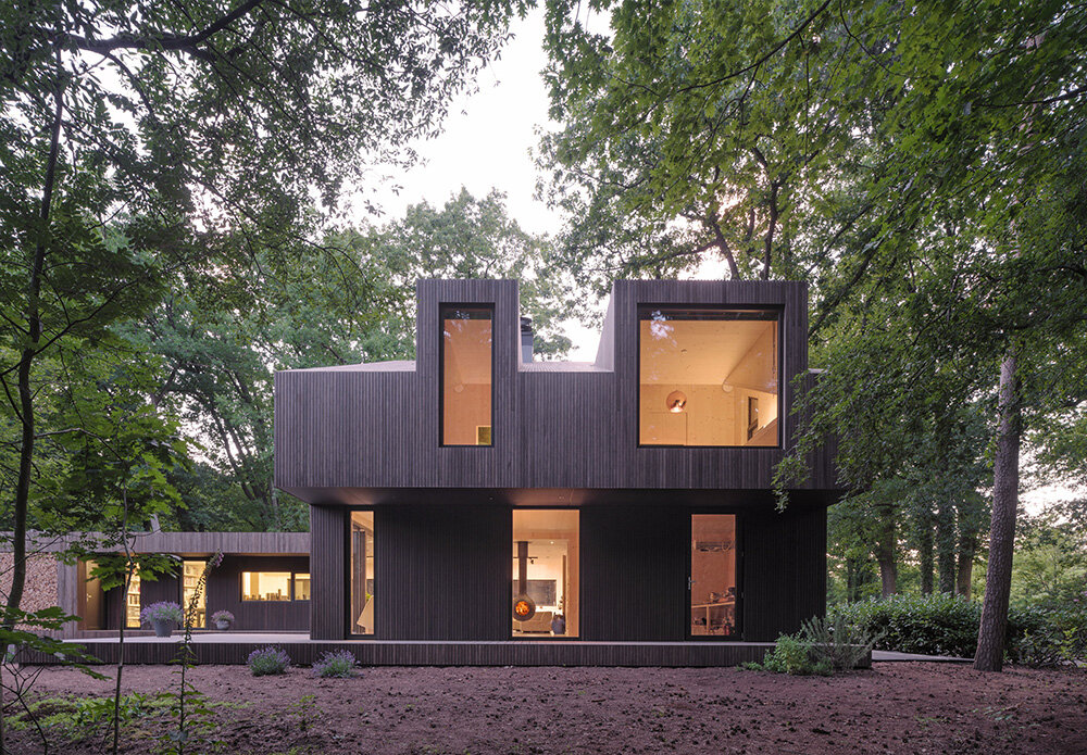 protruding windows bring nature inside spee architecten's sustainable ...