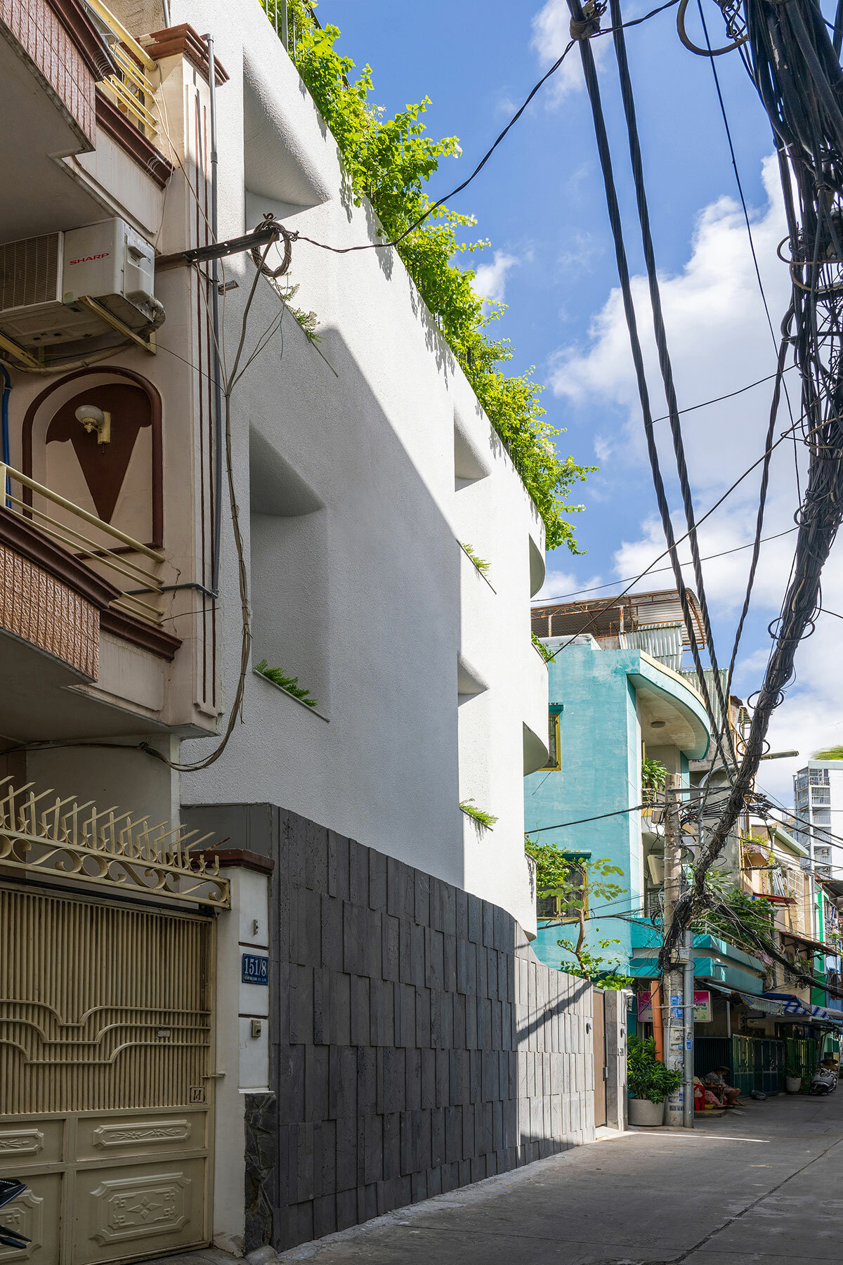 ROOM+ hides 'secret garden' inside sunlit townhouse in vietnam