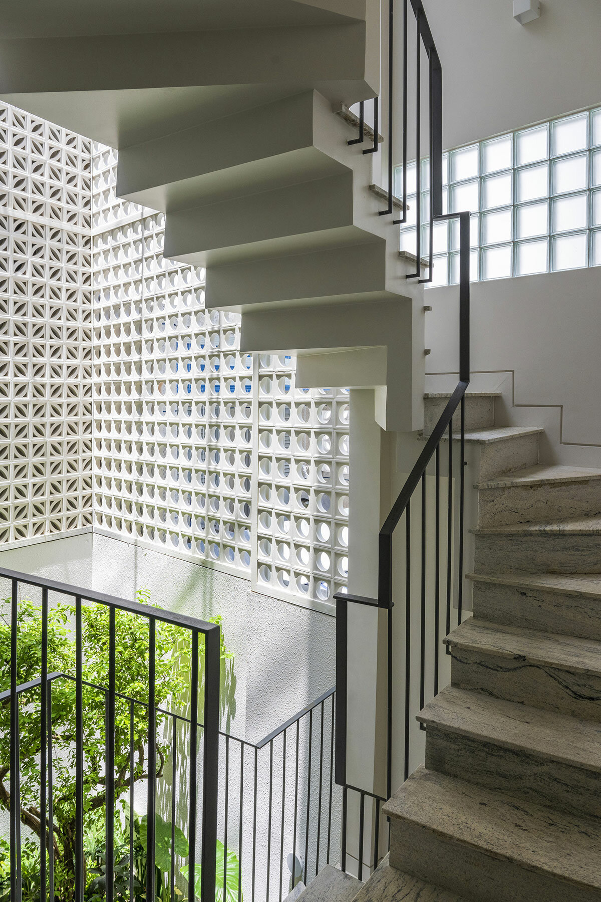 ROOM+ hides 'secret garden' inside sunlit townhouse in vietnam