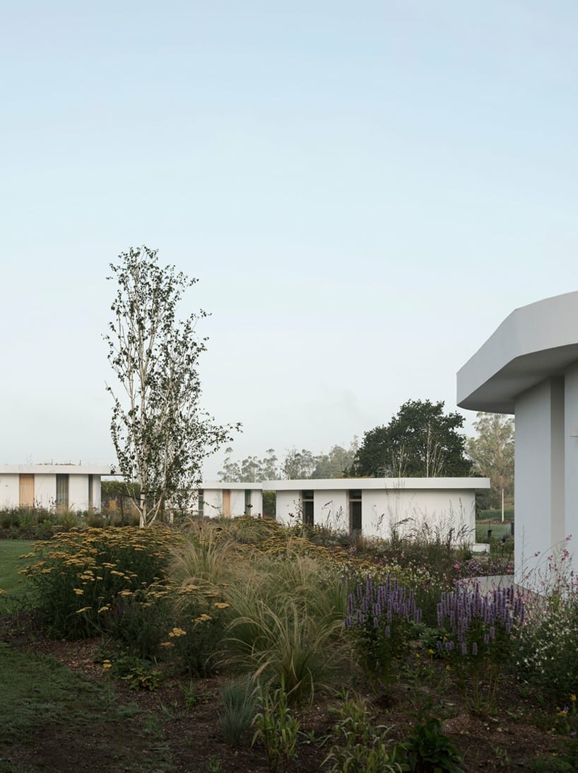 white rounded volumes form temporary stay cabins in spain