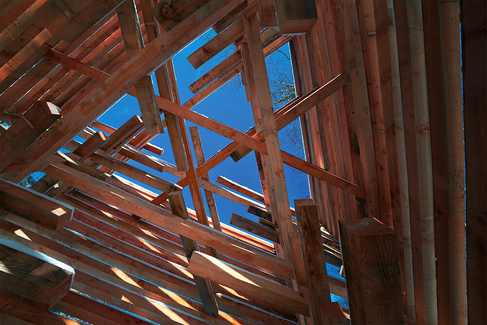 davide macullo's interwoven timber pavilions nestle in the swiss alps ...