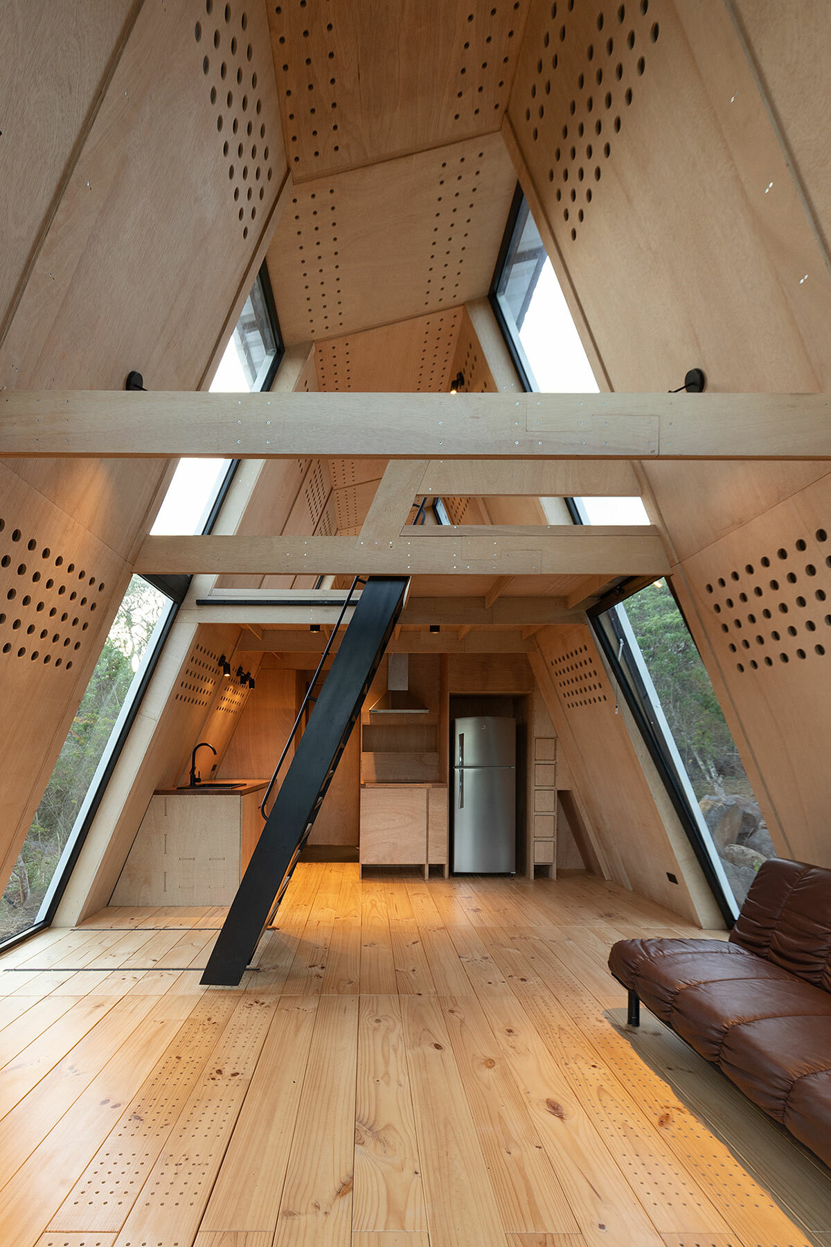 prefab SULA cabin journeys from quito to its galápagos island site