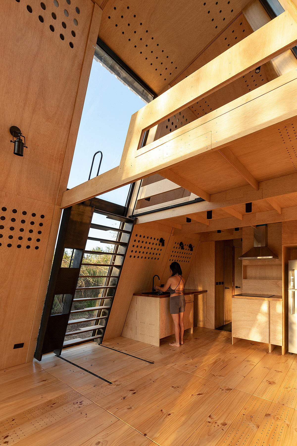 prefab SULA cabin journeys from quito to its galápagos island site