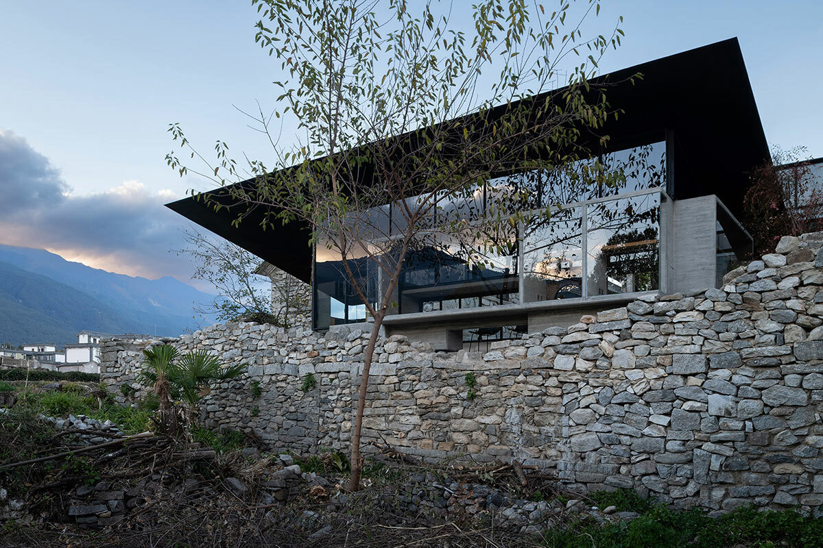 arCONNECT revives cavernous stone ruins with glass studio space