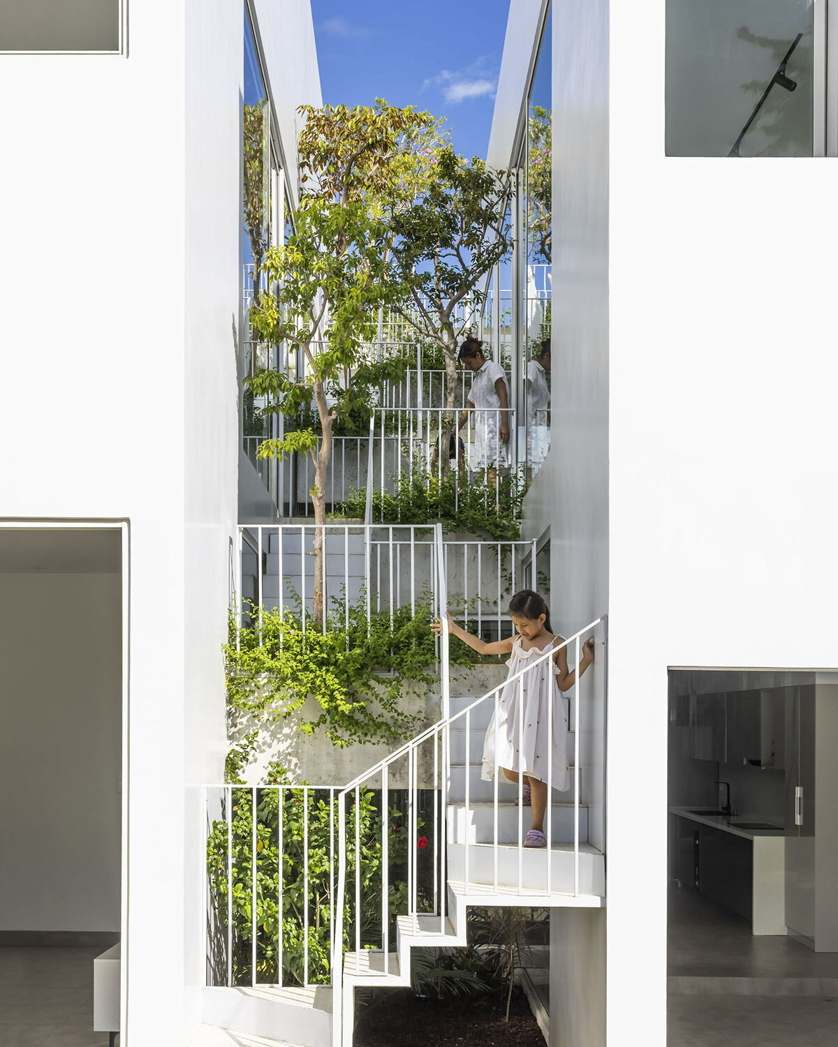 nguyen khai architects infuses 'nala house' with gardens in vietnam
