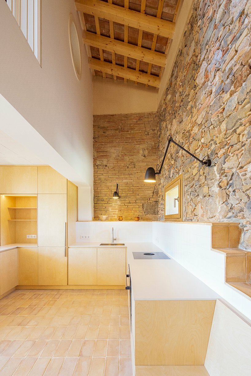 brick-clad sheep barn in spain transforms into family home
