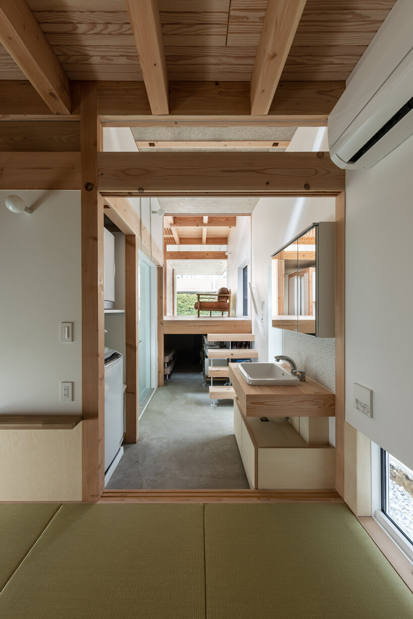 interconnected skipped floors outline compact toneyama house in japan