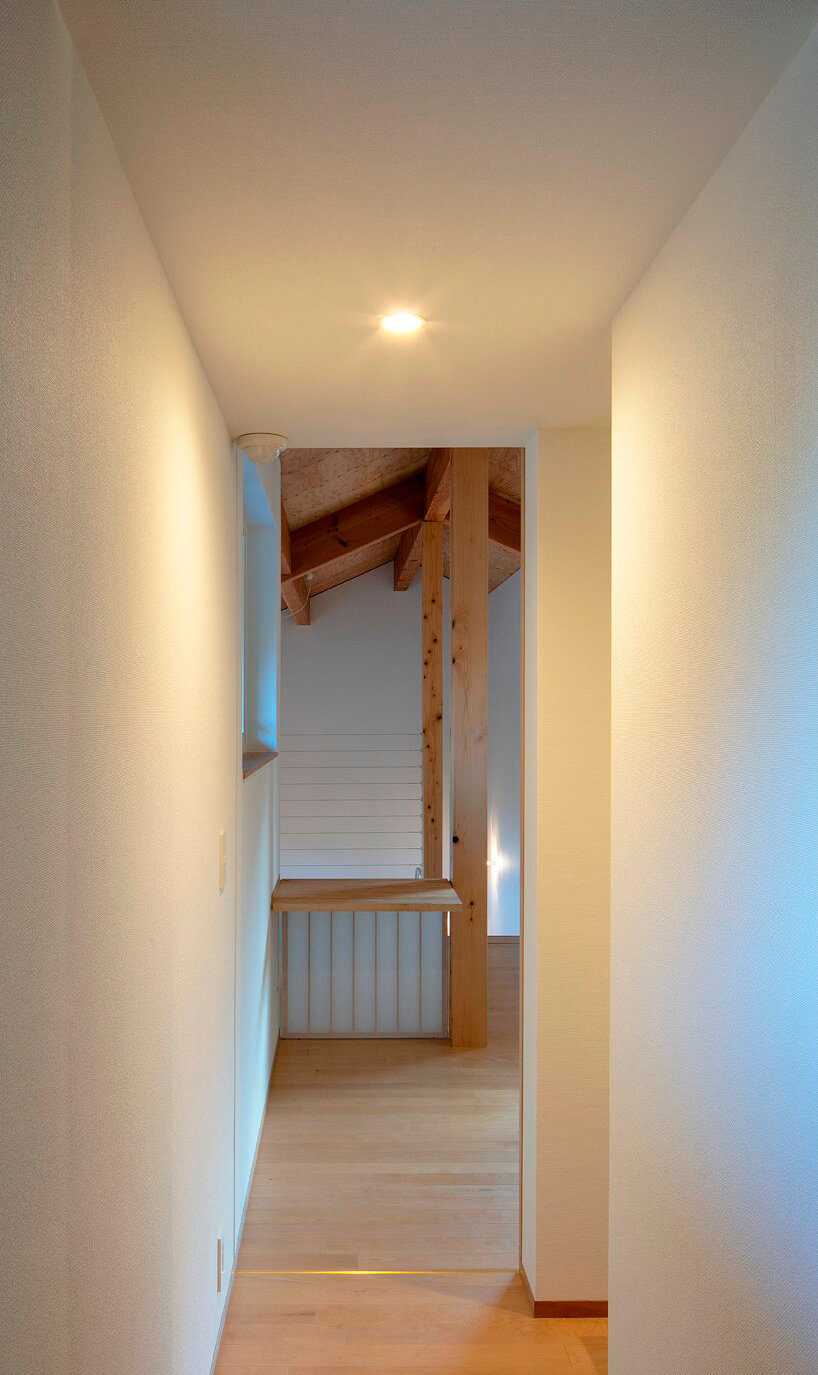 double gable roof tops house in kyoto reflecting the mountainous backdrop