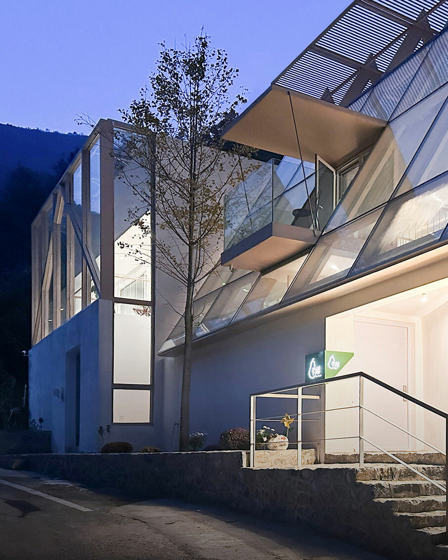 brick & cube architects' youli hotel glows within a mountain village