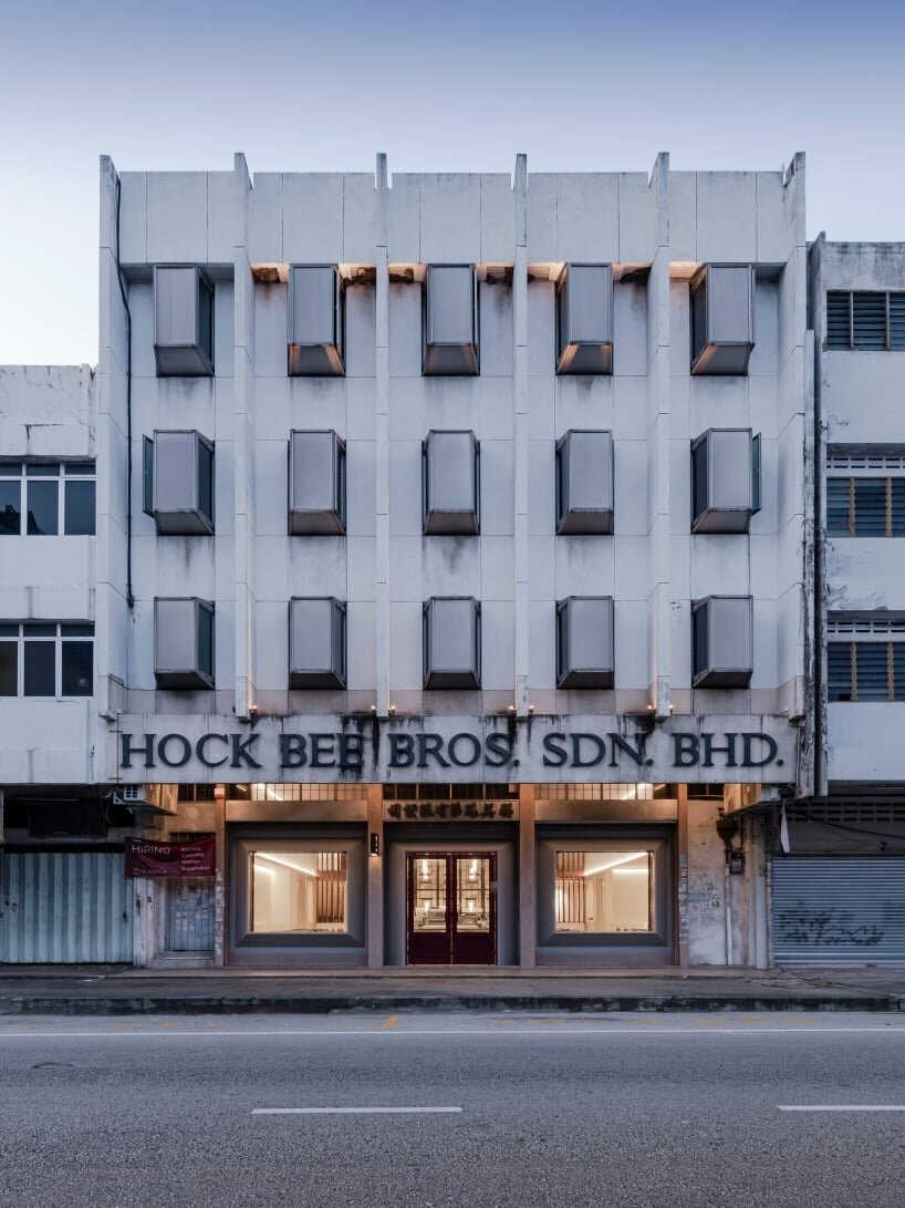jujurwork revives malaysian building as cafe with repurposed onyx ...