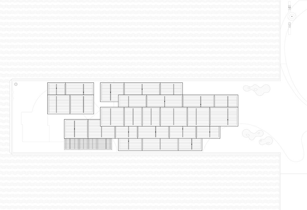 undulating canopy by new office works shelters waterfront promenade in hong kong