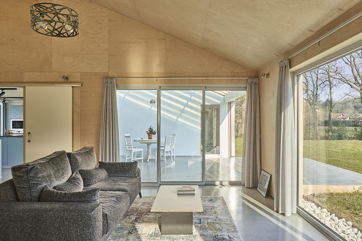 a cork and wood house is built by gurea arquitectura cooperativa