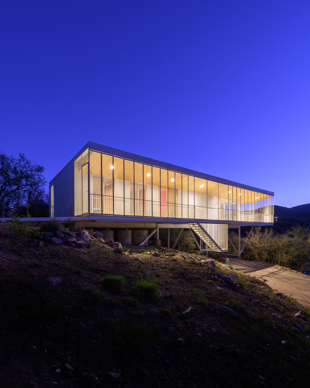 zayat arquitectura encases 'house in the clouds' with perforated panels ...