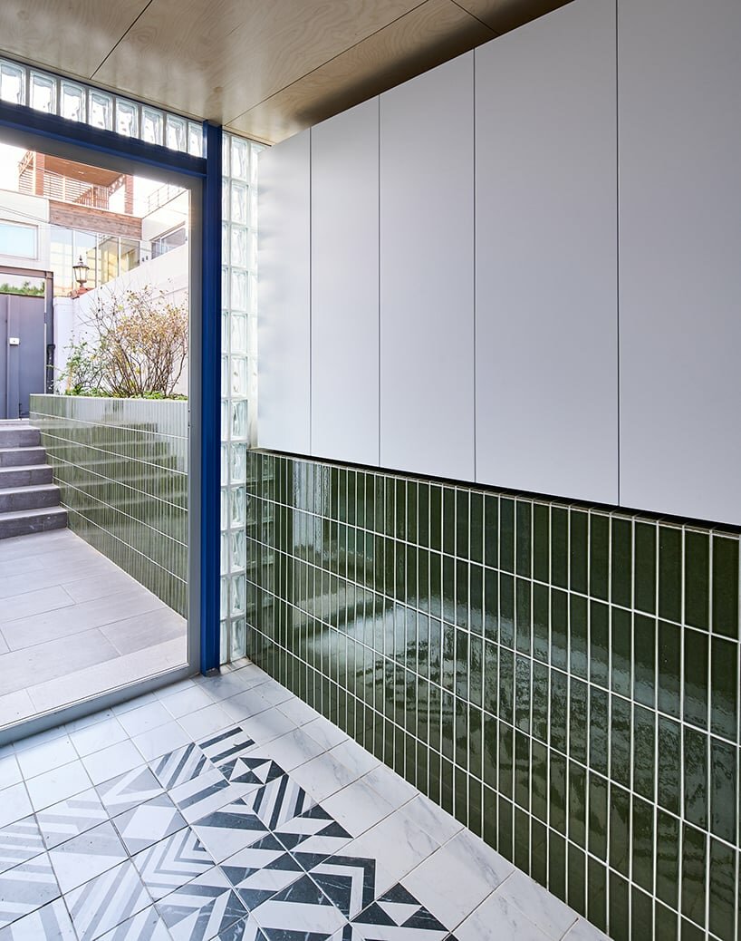 glass block surfaces by studio heech enclose brick structure in seoul