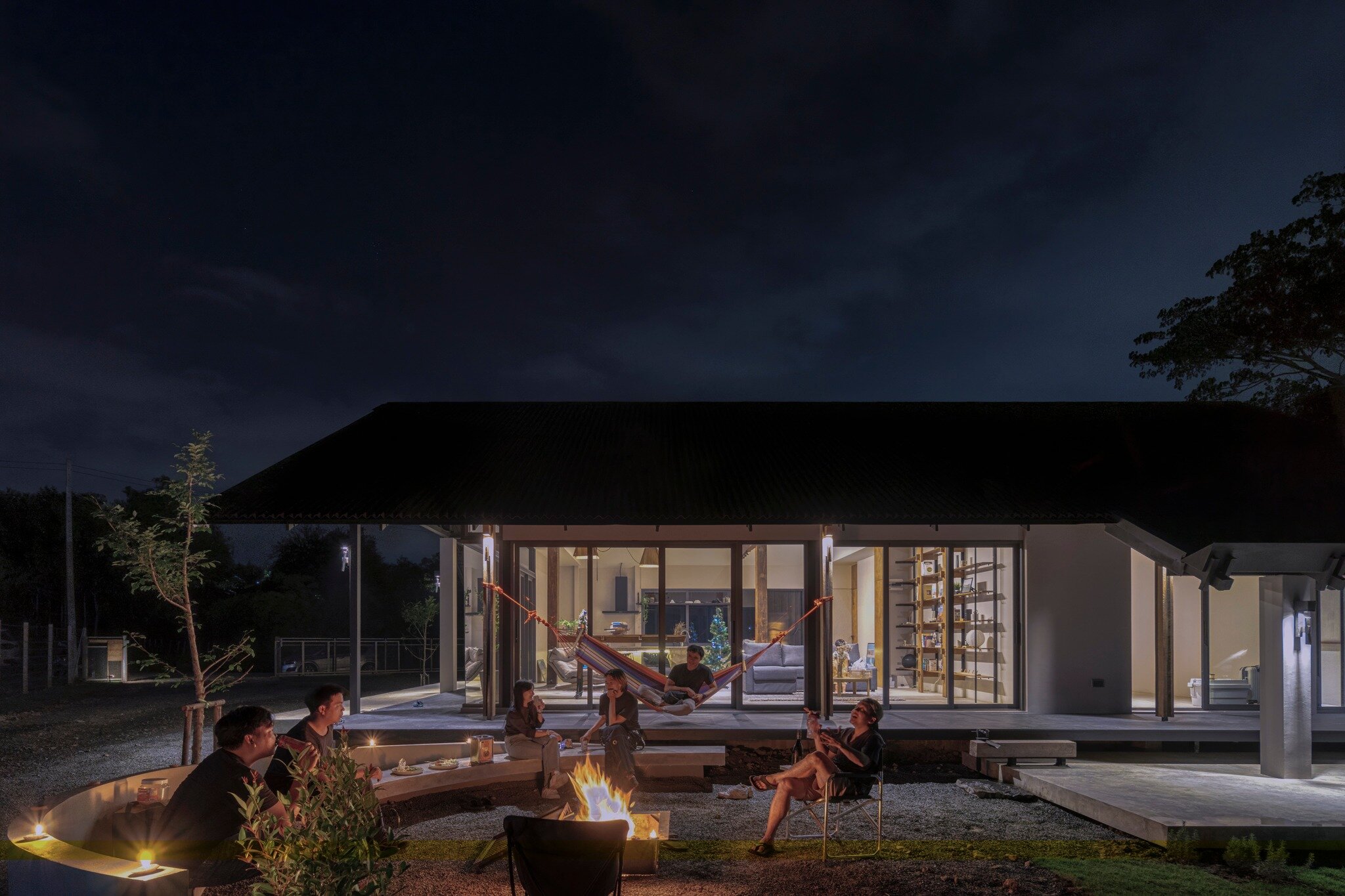 housescape design lab's cabin in thailand connects with lakeshore