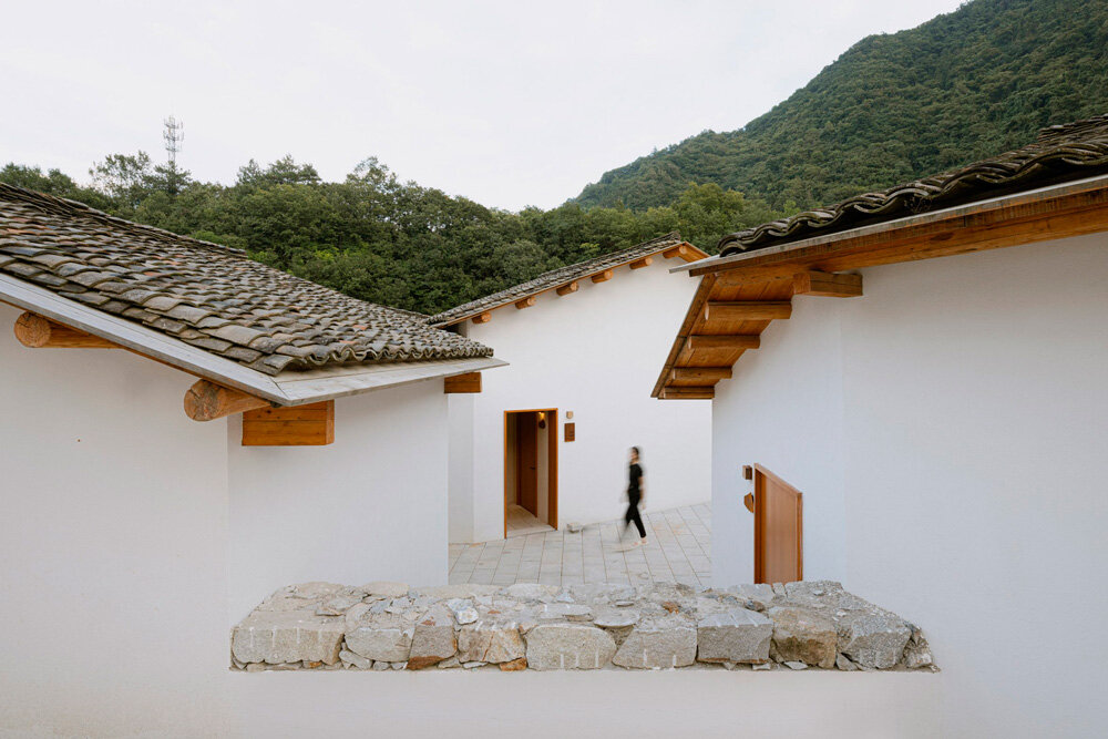 kooo architects embeds terraced pathways between hotel cottages in china