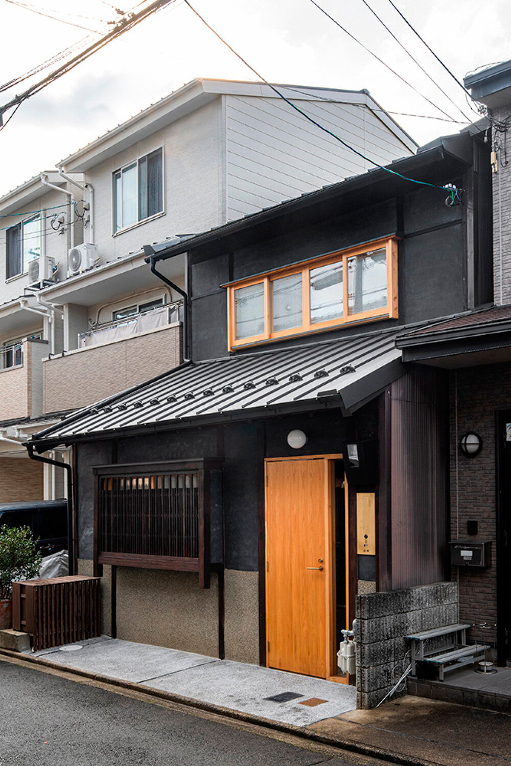 former textile workshop transforms into modern machiya residence in kyoto