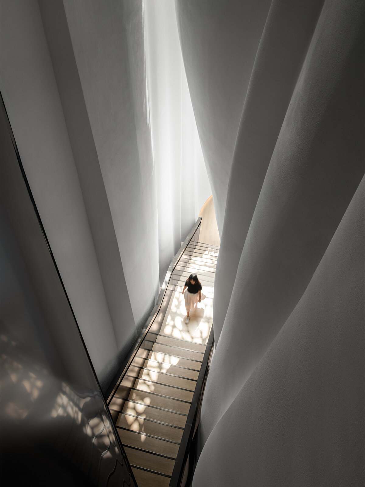 the veil: groundwork sculpts sinuous architecture like draped fabric
