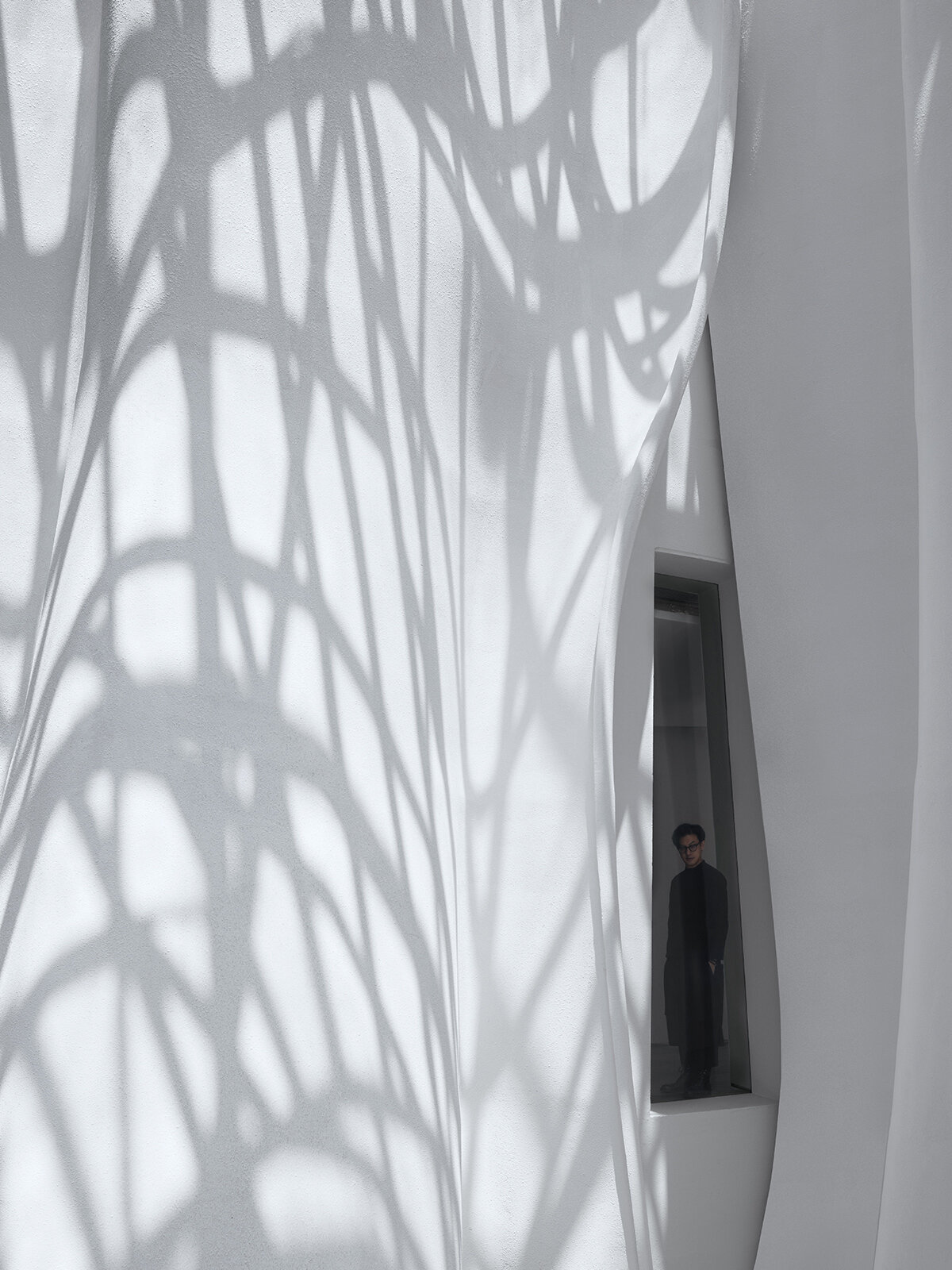 the veil: groundwork sculpts sinuous architecture like draped fabric