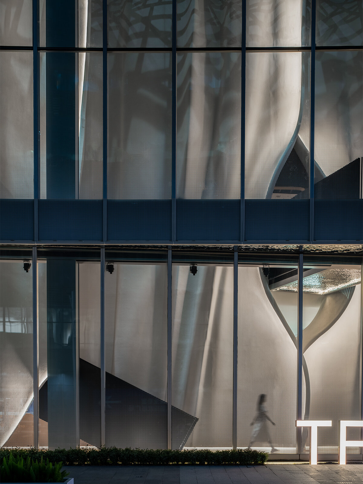 the veil: groundwork sculpts sinuous architecture like draped fabric