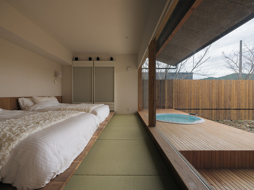 a viewing room protrudes from tetra works' rental villa in hiroshima