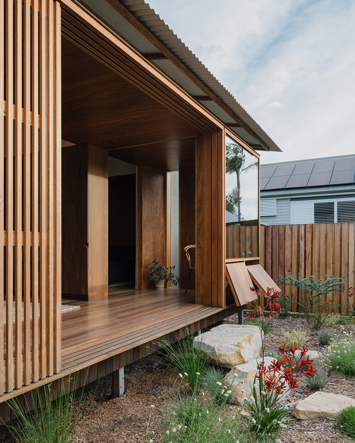 curious practice revives 'aru house' with brickwork & timber screens