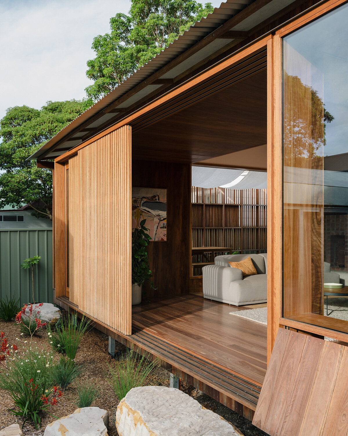 curious practice revives 'aru house' with brickwork & timber screens