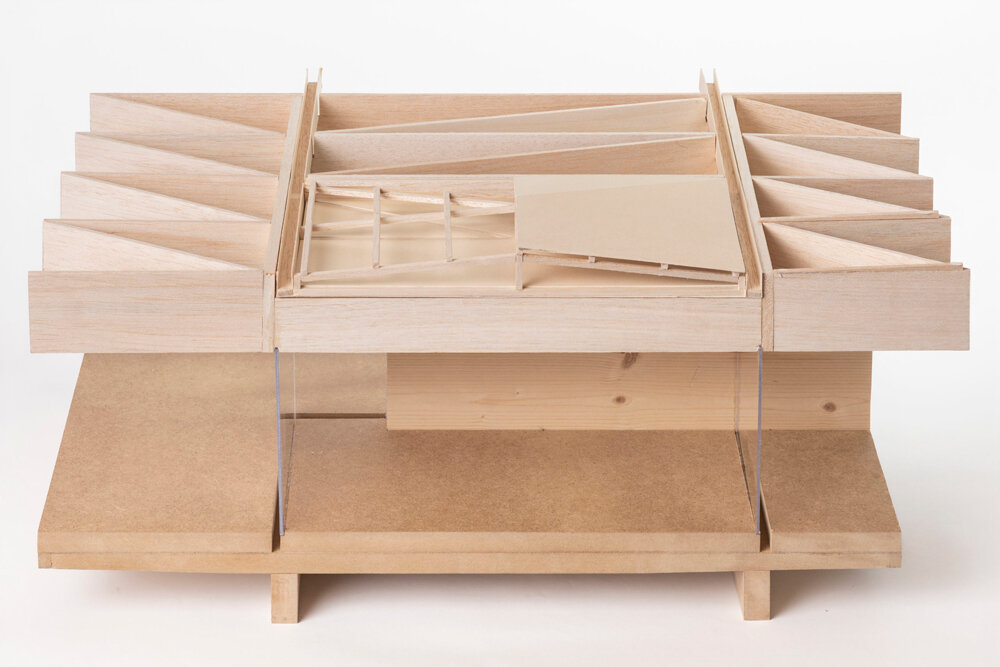 jagged wooden structure unfolds on top of ba holz house sitting along ...