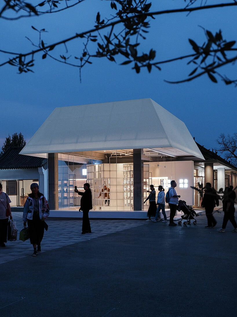 translucent pitched roof tops glass-clad store by designRESERVE in ...