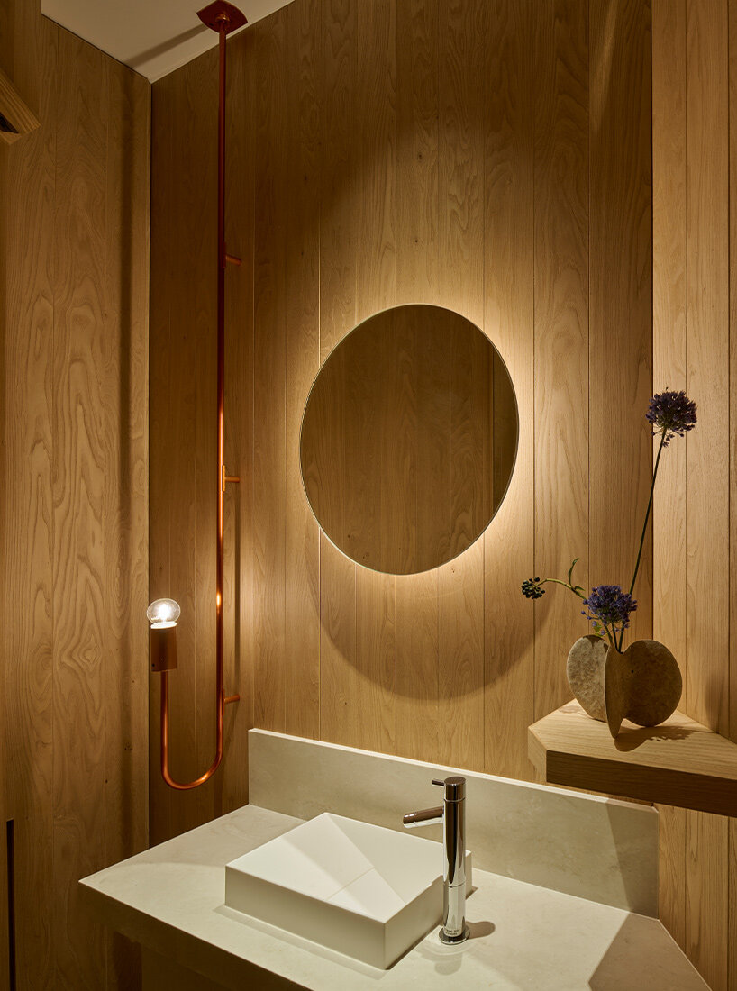 naoya matsumoto imbues earthy tones into isai restaurant in osaka