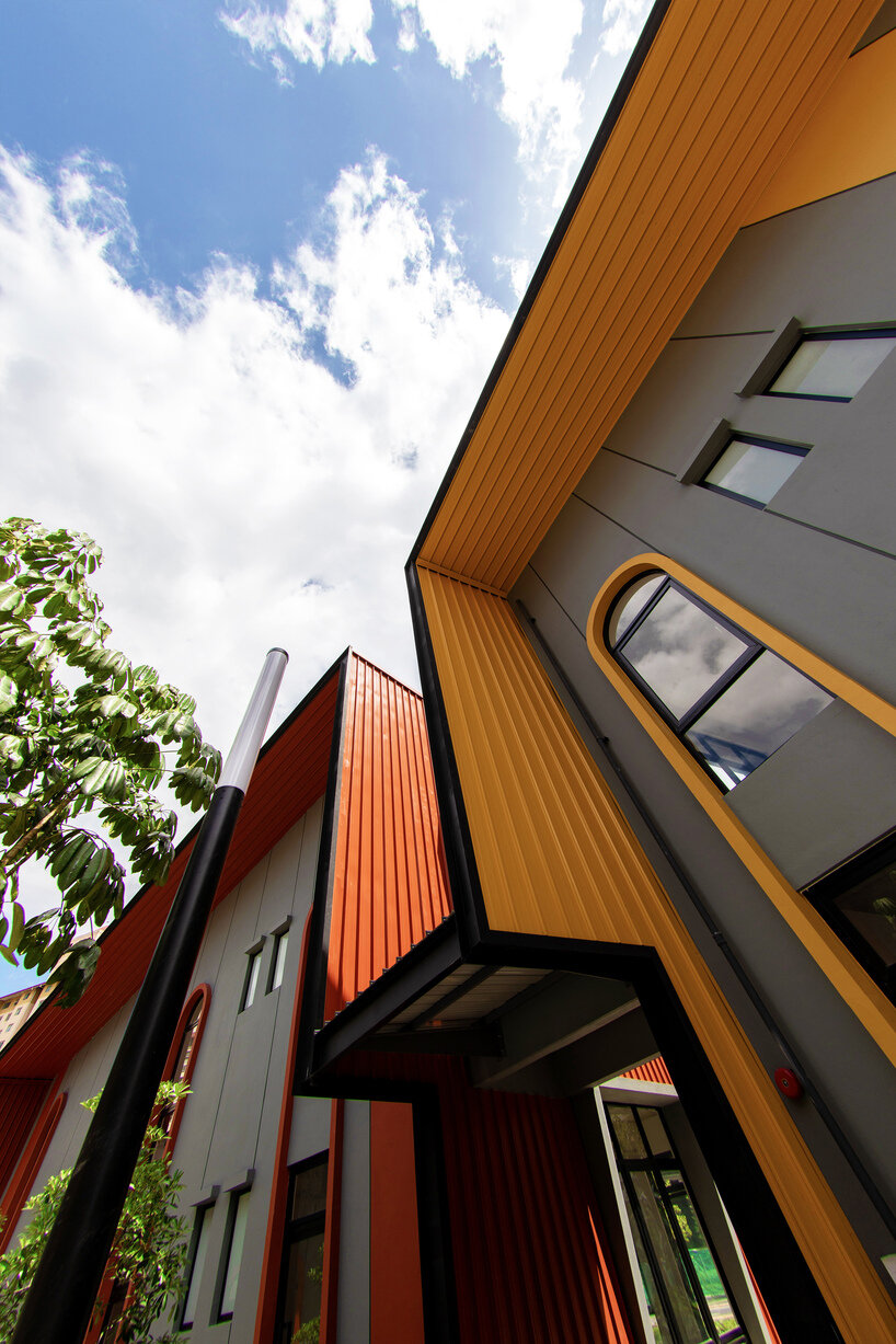 colorful roofed units compose TKCA architect's sama square market ...