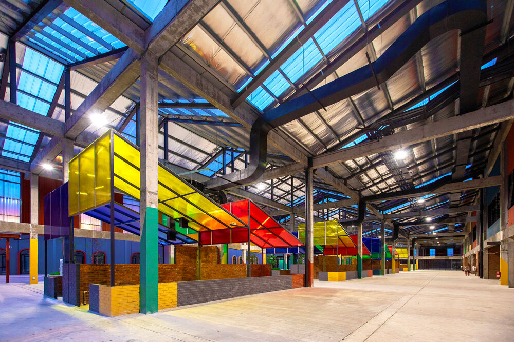 colorful roofed units compose TKCA architect's sama square market ...