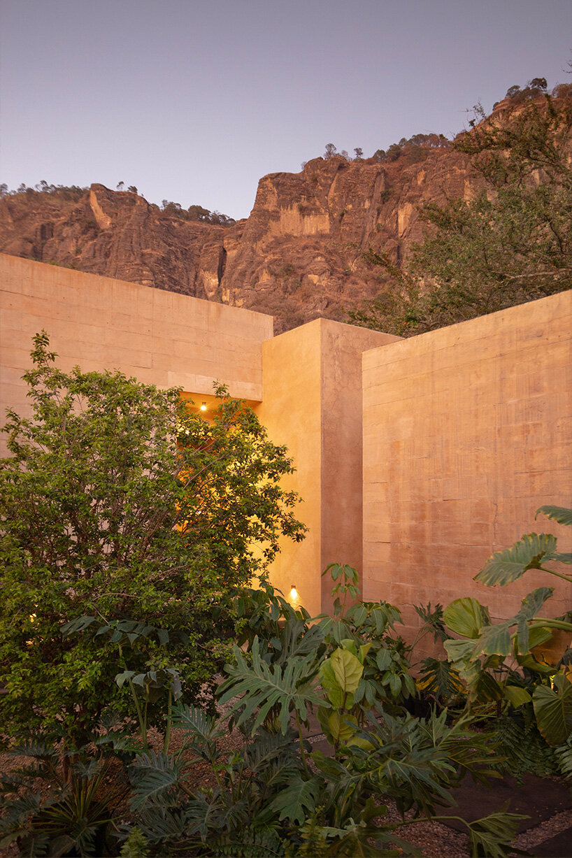 RA! sculpts monolithic house emerging from rocky cliffs in mexico
