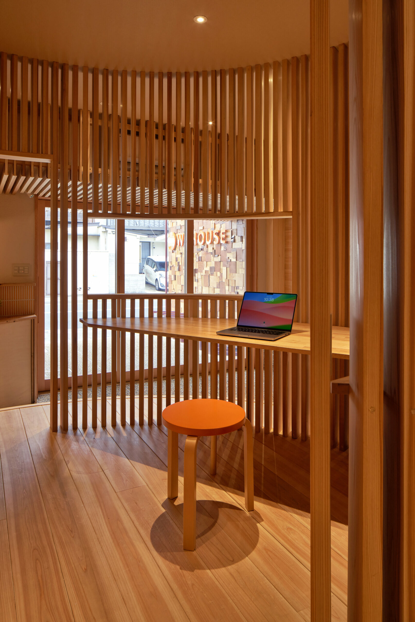 wooden louvers run along kyoto office space's entire interior by ...