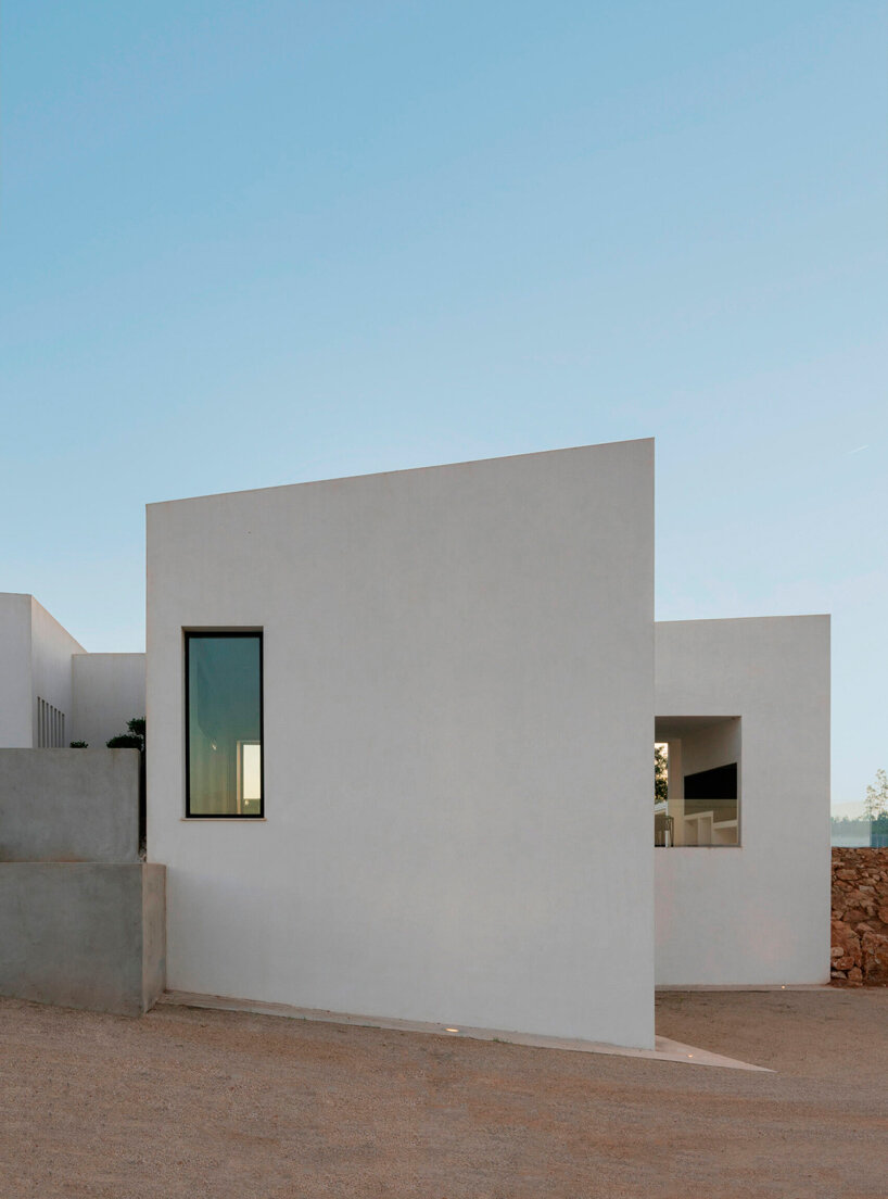 four solid white blocks outline wind house by ruben muedra arquitectura ...