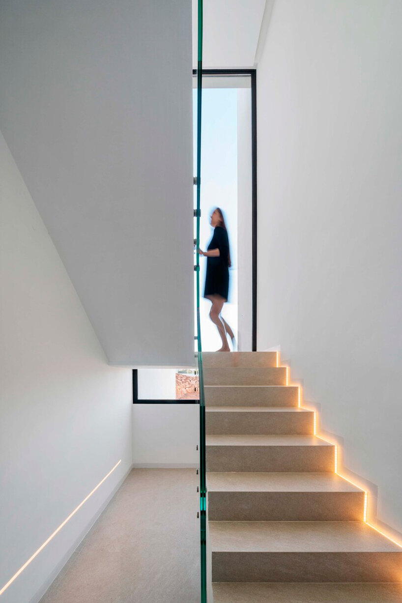 four solid white blocks outline wind house by ruben muedra arquitectura ...