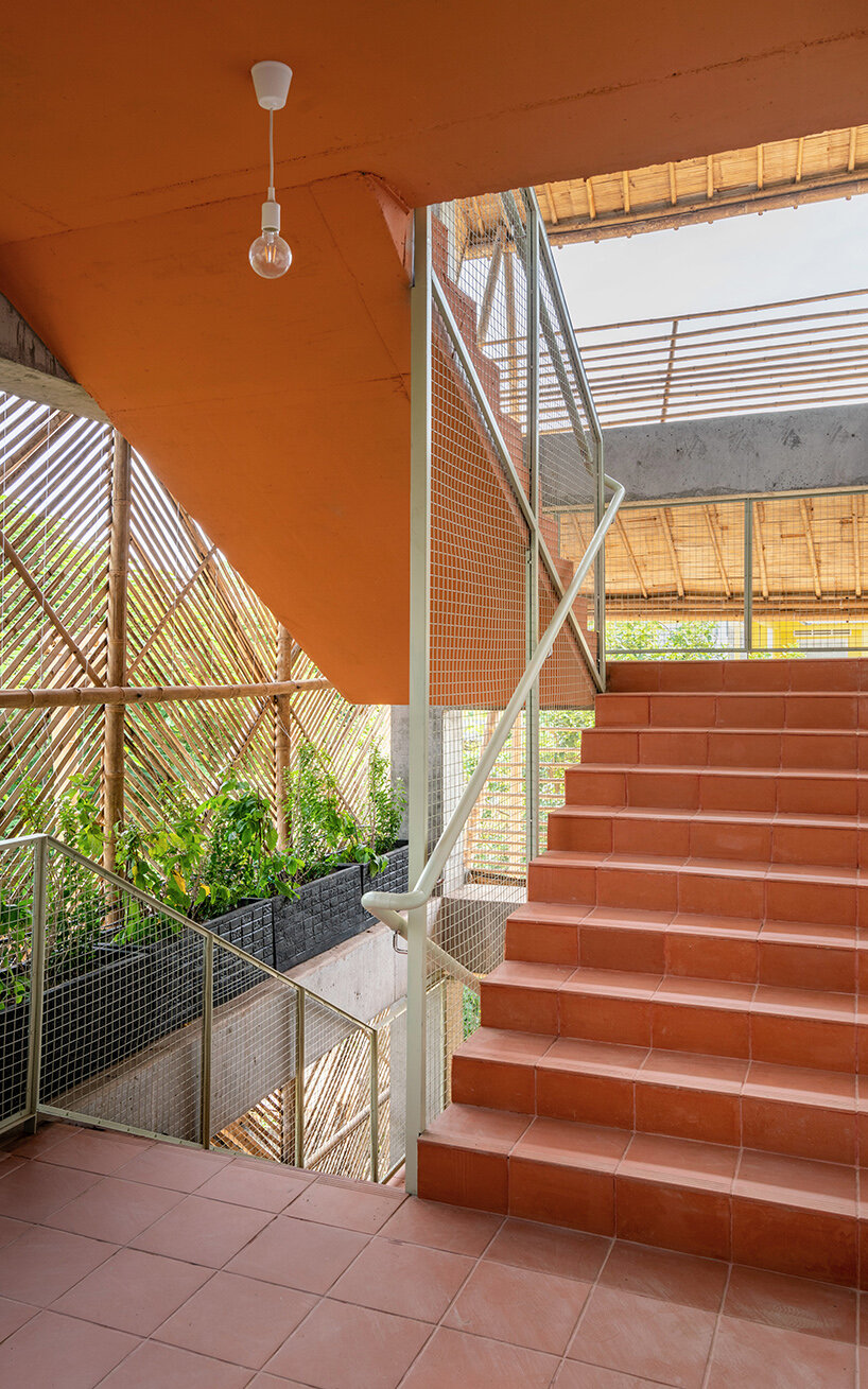 BLOOM screens girl dormitory's concrete skeleton with woven bamboo skin