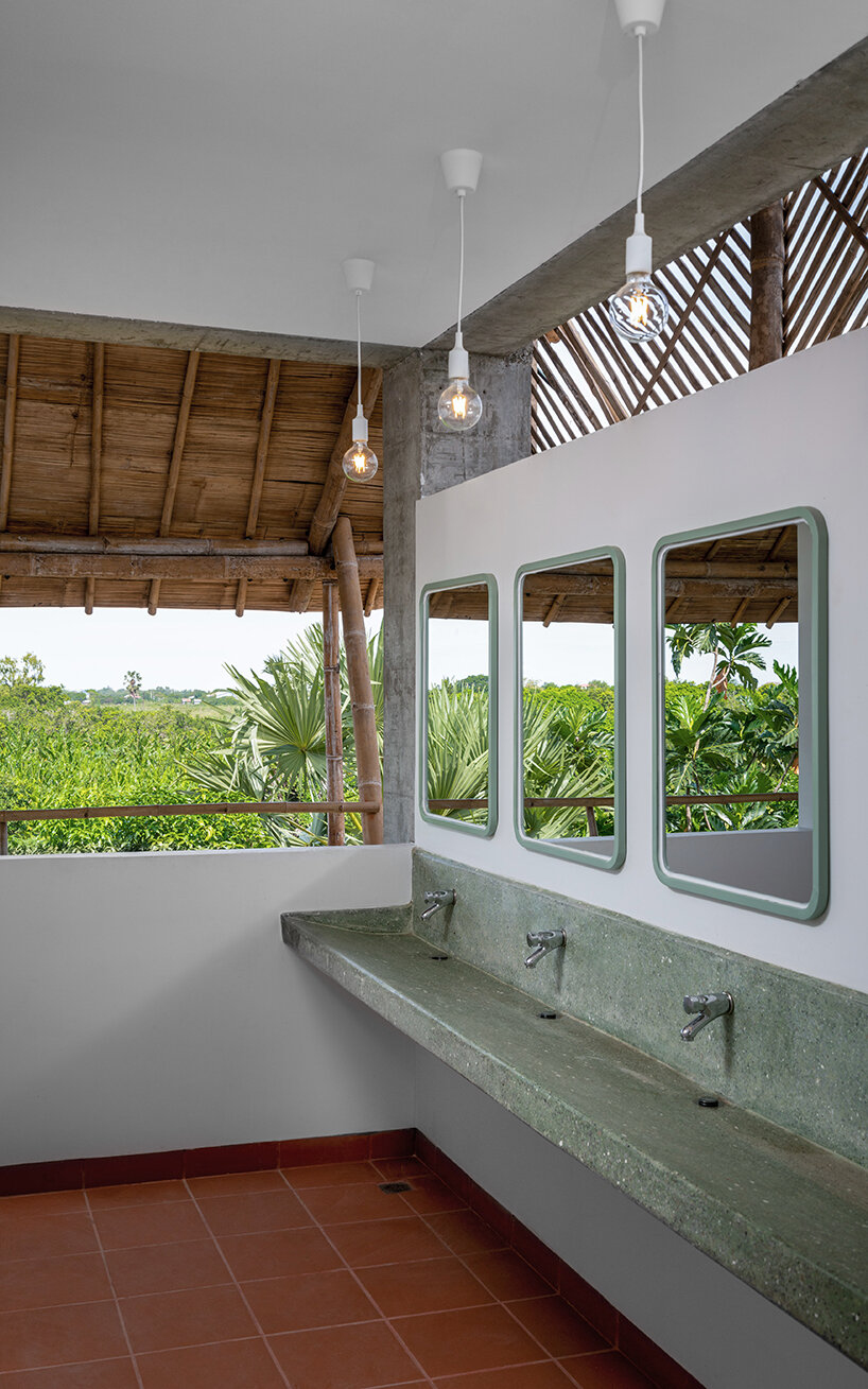 BLOOM screens girl dormitory's concrete skeleton with woven bamboo skin