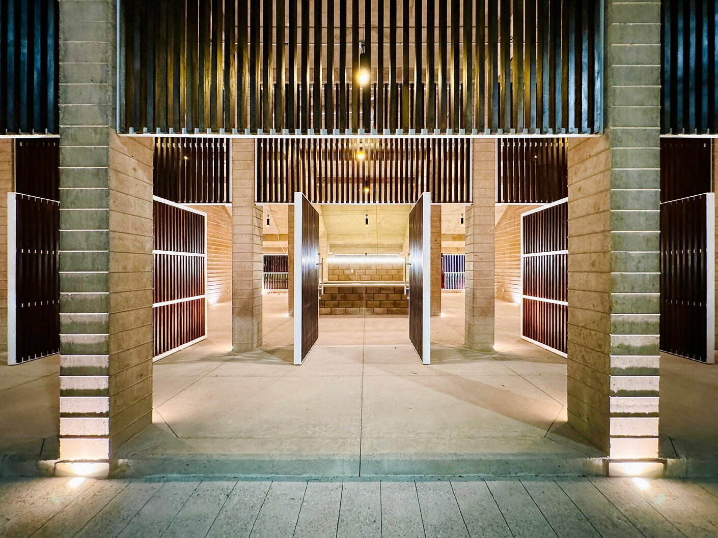 modular metal shell rests atop aidia studio's revamped sports center