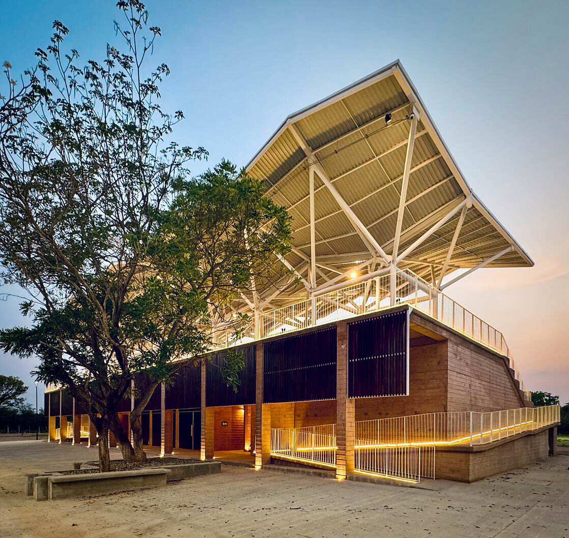 modular metal shell rests atop aidia studio's revamped sports center