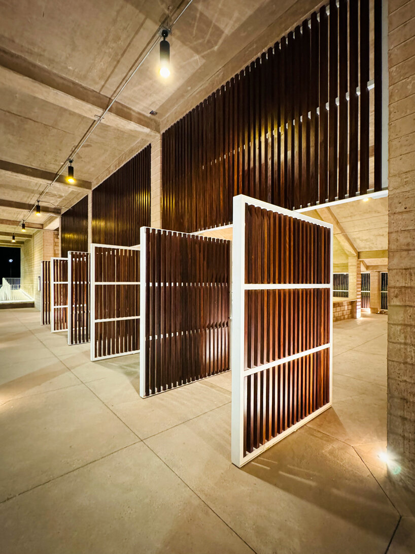 modular metal shell rests atop aidia studio's revamped sports center