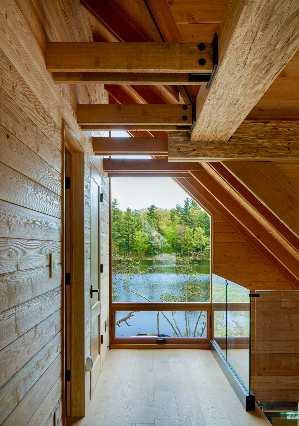 undulating shoreline envelops six mile lake cottage by BLDG workshop