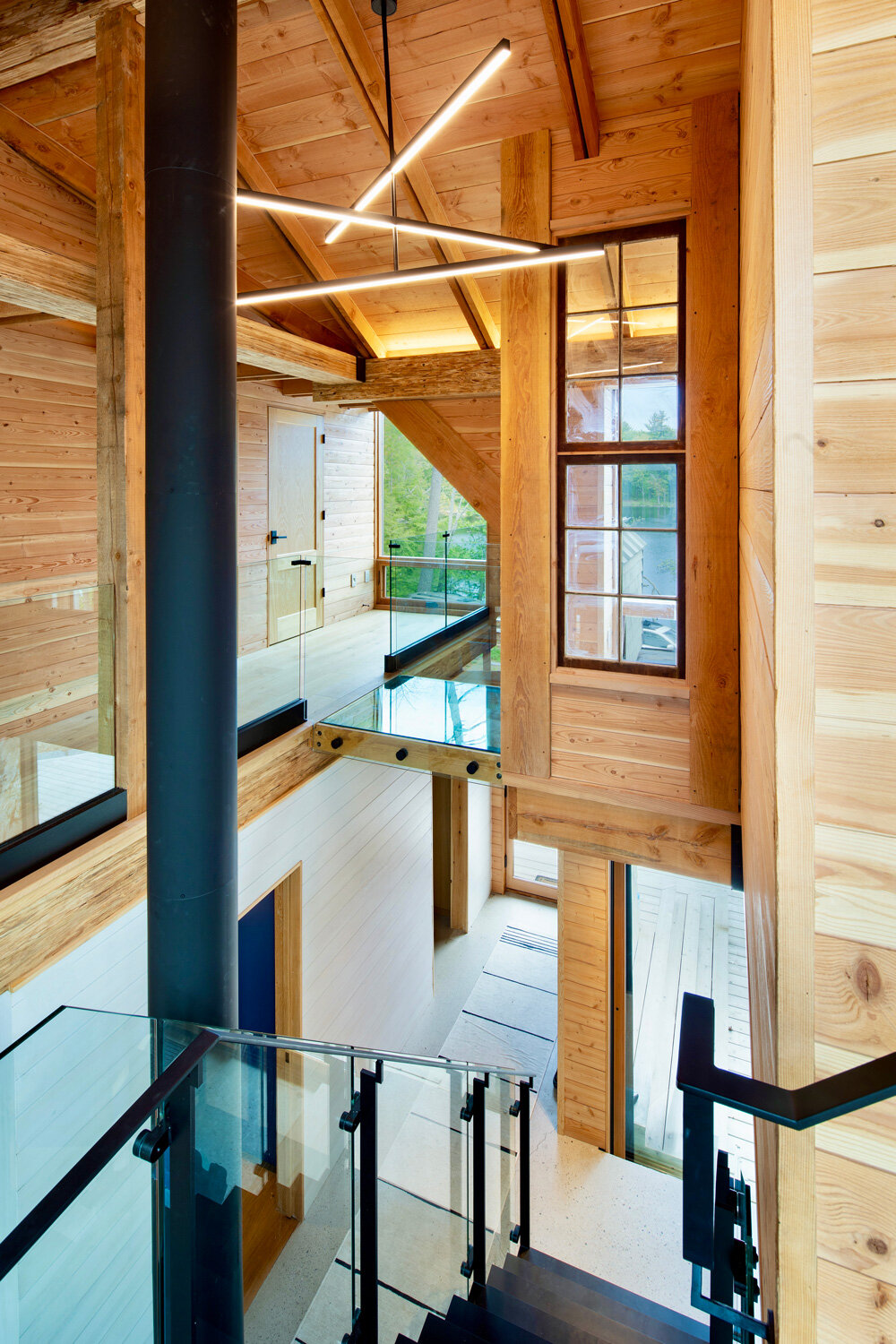 undulating shoreline envelops six mile lake cottage by BLDG workshop